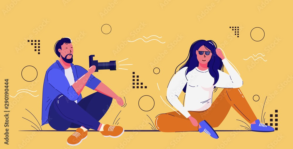 professional male photographer using digital dslr camera shooting ...