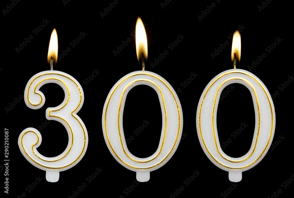 Burning birthday candles isolated on black background, number 300 Stock ...