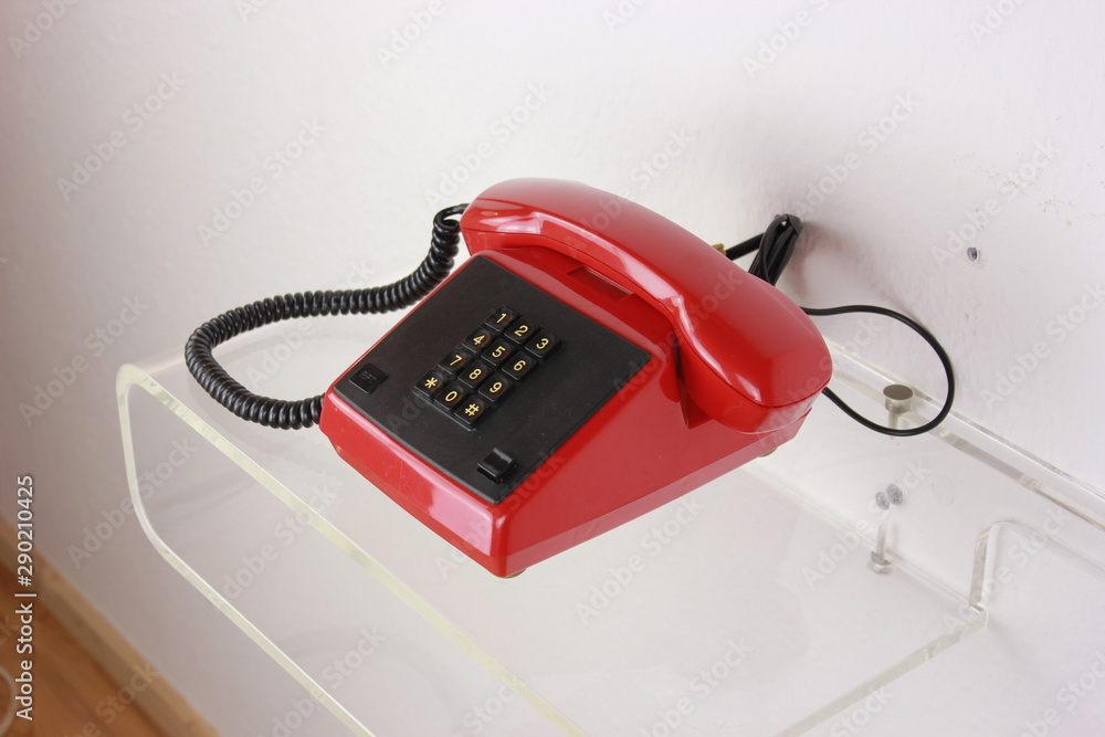 old retro telephone red green plastic isolated on white background side ...