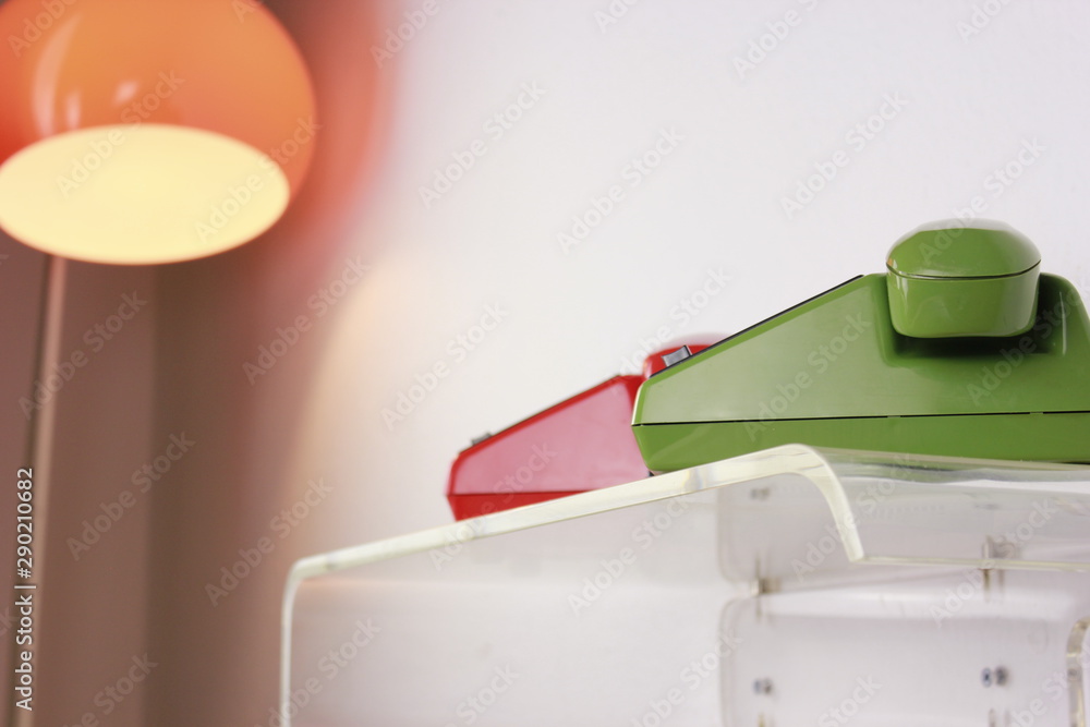 old retro telephone red green plastic isolated on white background side ...