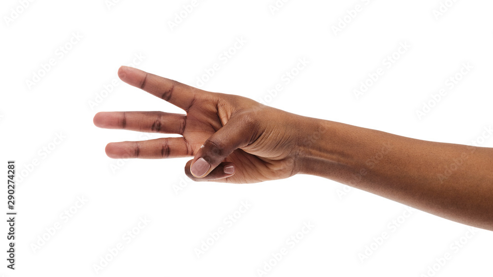Black female hand showing three fingers, counting on white background ...