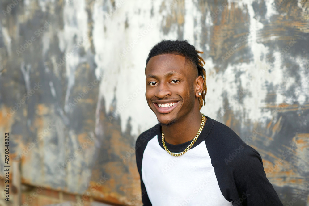 happy African-American Teen Teenager male Man outside in a baseball ...