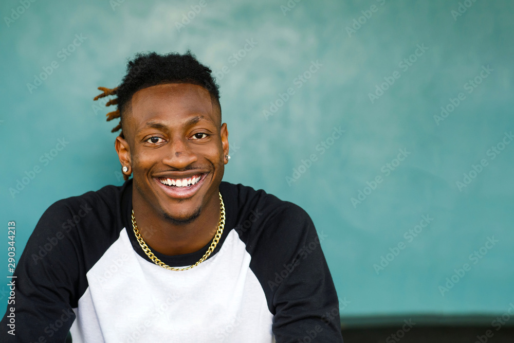 happy African-American Teen Teenager male Man outside in a baseball ...