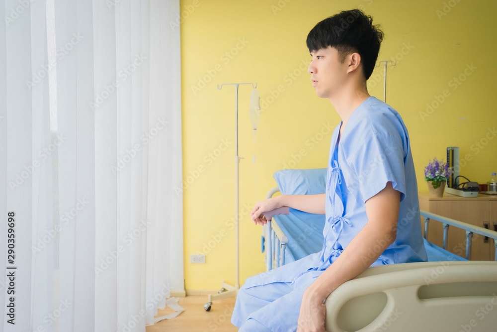 Patient asian man 25 year old Wear a sick suit feeling unwell and worry ...