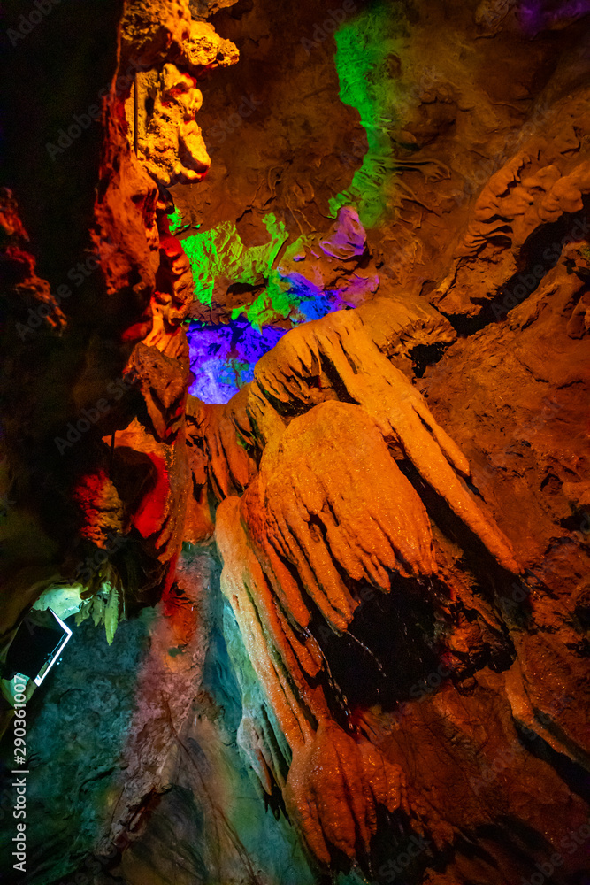 Beautiful illuminated multicolored stalactites in Danzhou Stone Flower ...