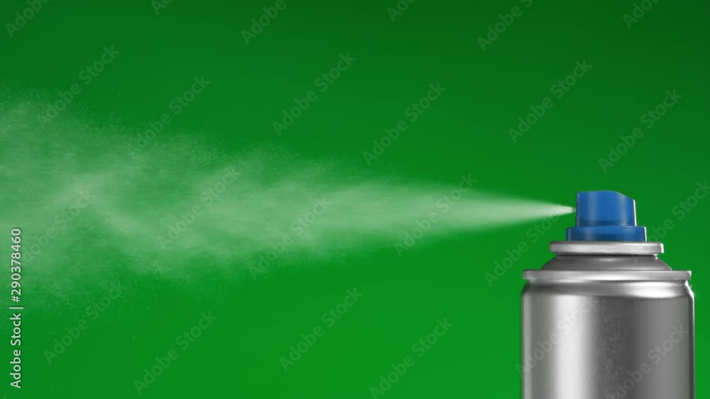 spray can on green background sprays fountain of vaporized foam ...