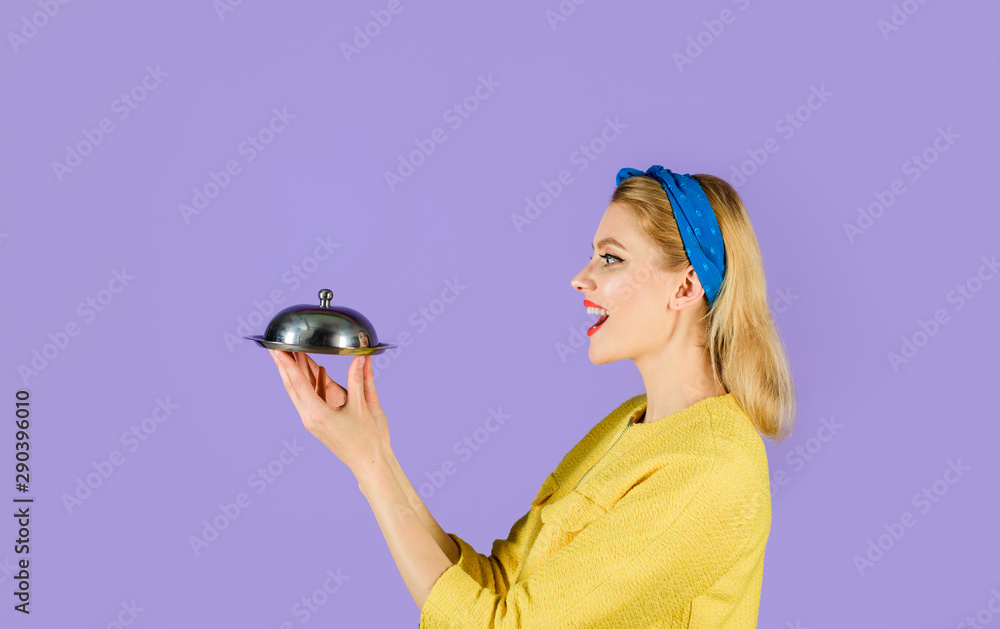 Presentation. Retro woman holds metal tray with lid. Restaurant serving ...