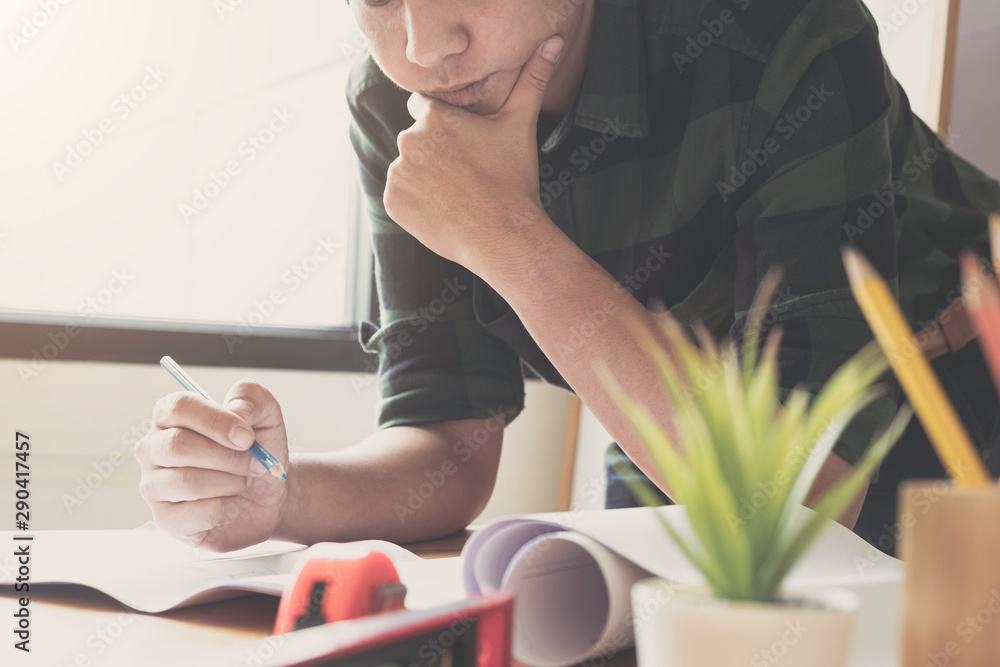 Image of engineer drawing a blue print design building or house, An ...
