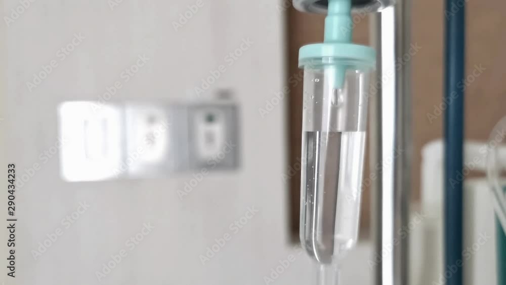 close up intravenous saline solution drop drip for treatment. Focus ...