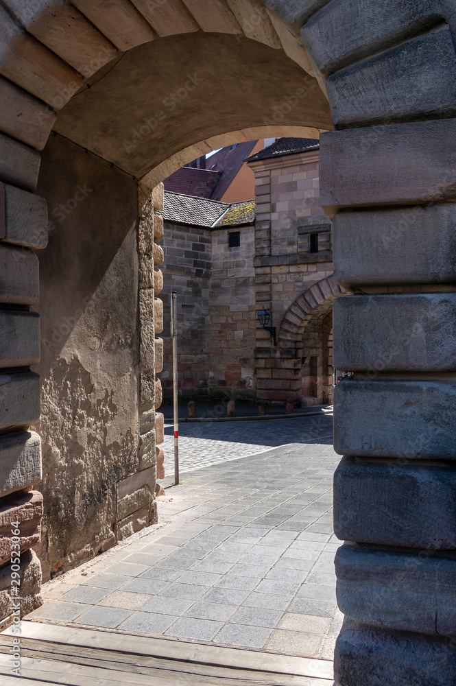 Nuremberg city wall with gate Neutor, passage through the thick and ...