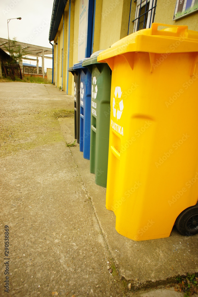 garbage disposal bins in various colors for sorting and recycling Stock ...
