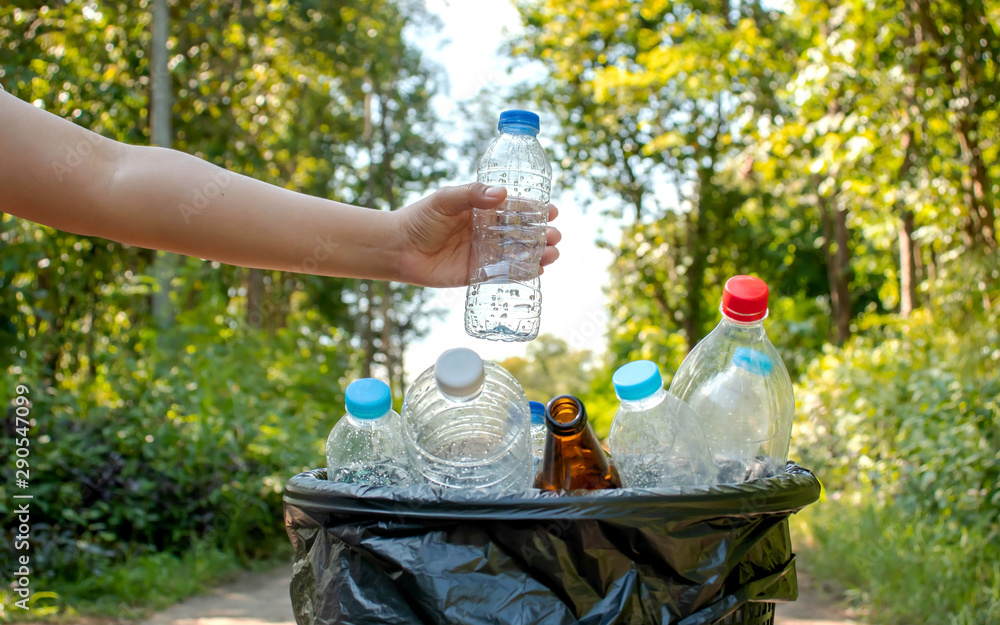 Collecting plastic bottles and glass bottles for reuse. Waste recycling ...