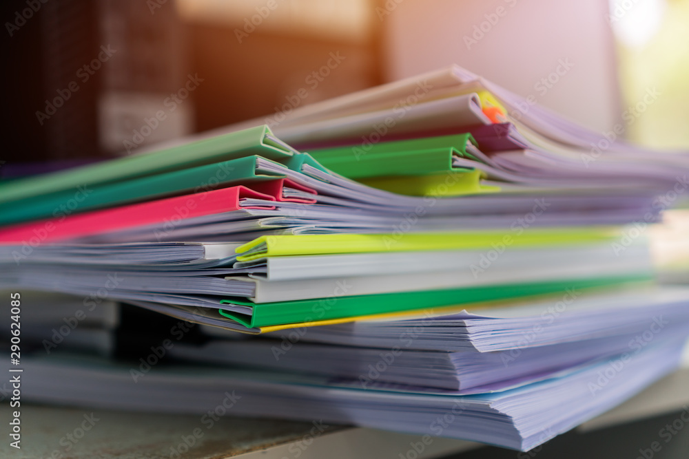 Piles unfinished documents reports files with overwork paper corner on ...