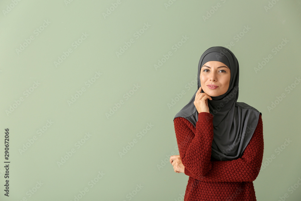 Portrait of thoughtful Muslim woman on color background Stock Photo ...