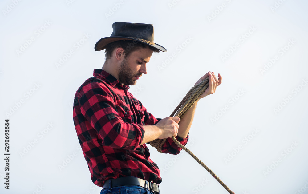 Ranch worker. Eco farm. Life at ranch. Cowboy with lasso rope sky ...
