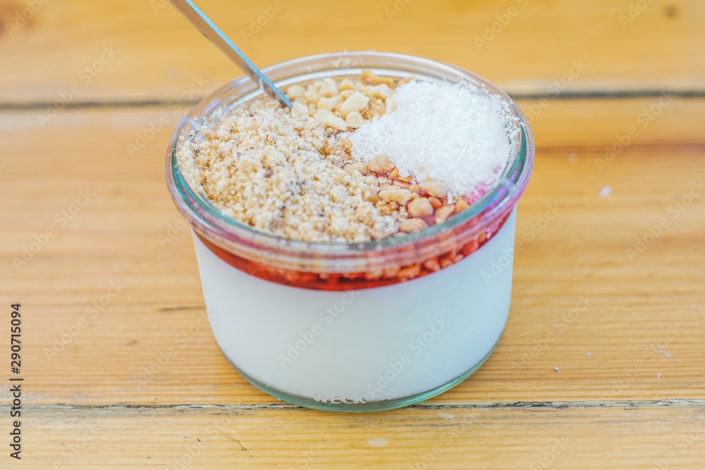 "Malabi" on a wooden table - "Malabi" is the Israeli ultimate dessert ...