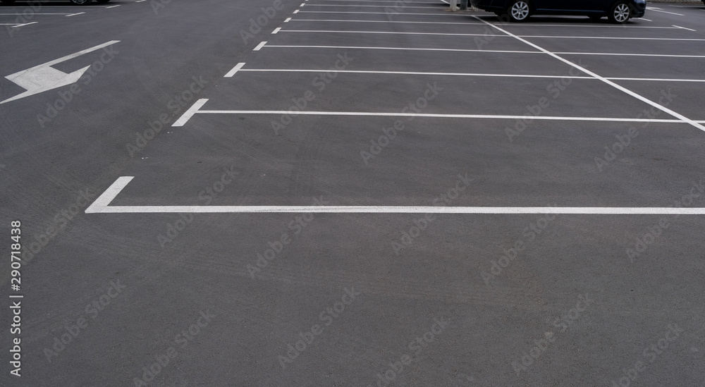 Empty parking with clear markings and arrows indicating the direction ...