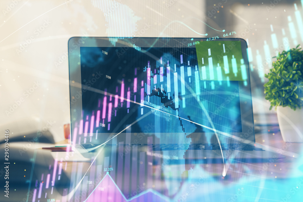 Stock market graph on background with desk and personal computer ...