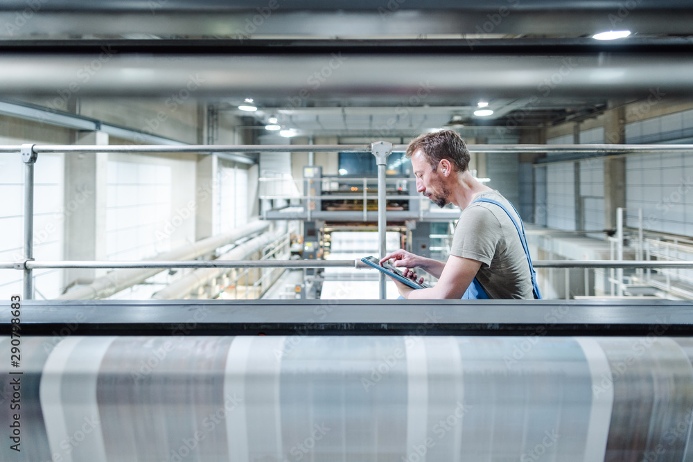 Engineer monitoring the printing press for a daily paper Stock Photo ...