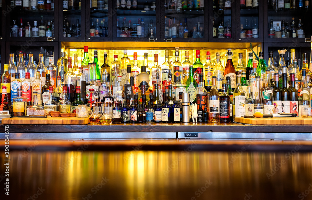 Bottles of alcohol and spirits displayed at a well stocked bar in New ...