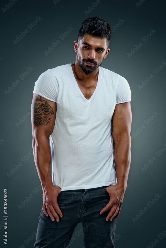 Handsome Male Fitness Model Wearing Jeans and White T-Shirts Stock ...