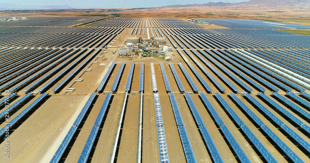 Solar panels in a solar farm in Spain. There is the reflection of the ...