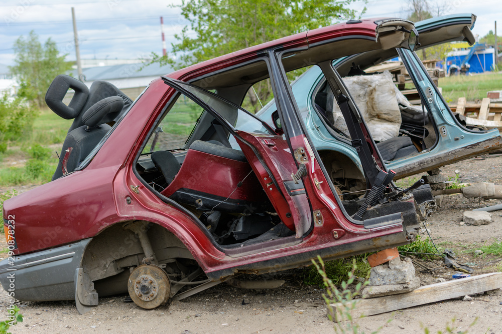 Broken, crumpled, dented car after the accident. Abandoned wrecked cars ...