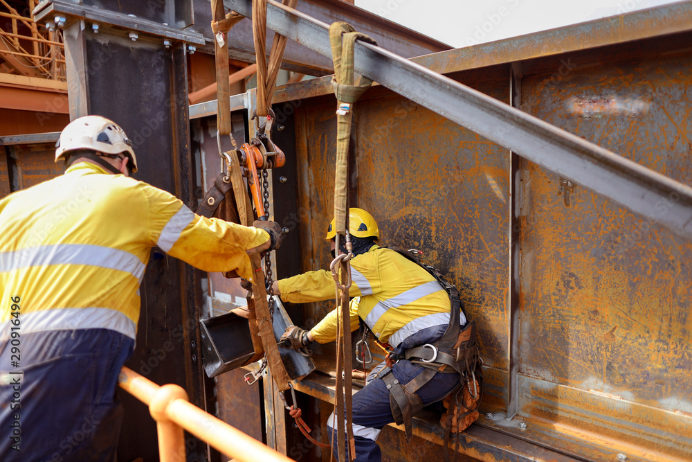Construction worker wearing safety harness helmet head full protection ...