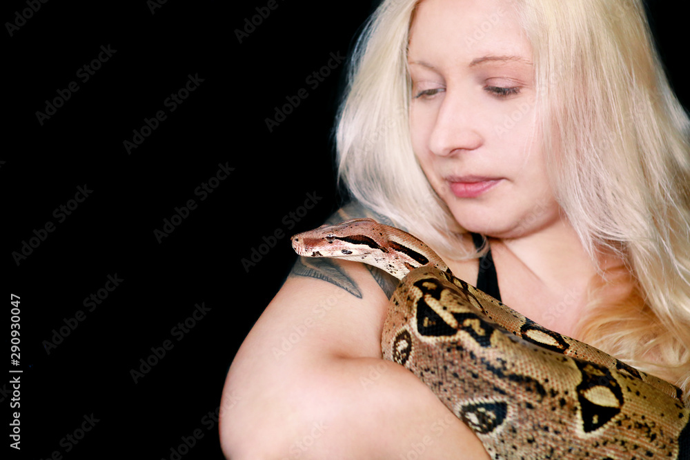 Portrait of girl with Boa constrictor snake. Beautiful woman holds ...