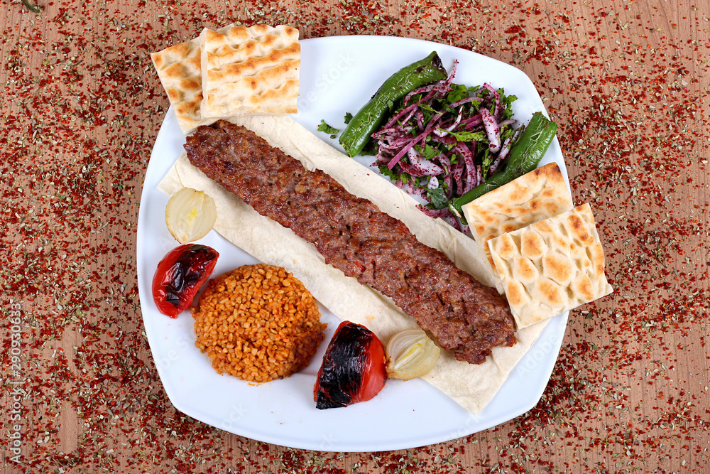 Full-service turkey barbecue with green peppercorns and vegetables on a ...