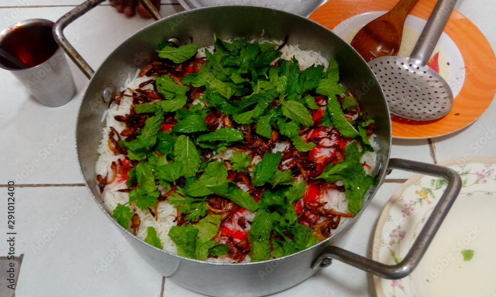 Hyderabad Chicken Spicy fried rice is ready to serve and decorations by ...