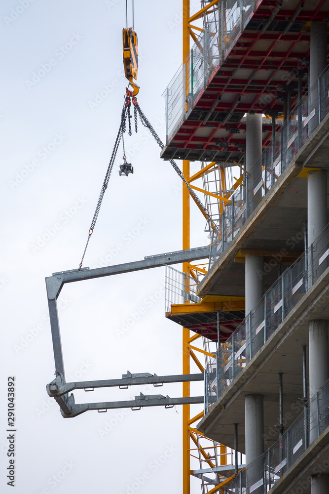 Crane hoisting block with hook on steel chain on the steel rope lift ...