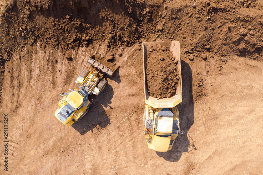 Excavator loading soil onto an Articulated hauler Truck, Top down ...