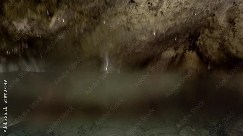 Plastic pollution, Underwater split level. A plastic bottle floats on ...