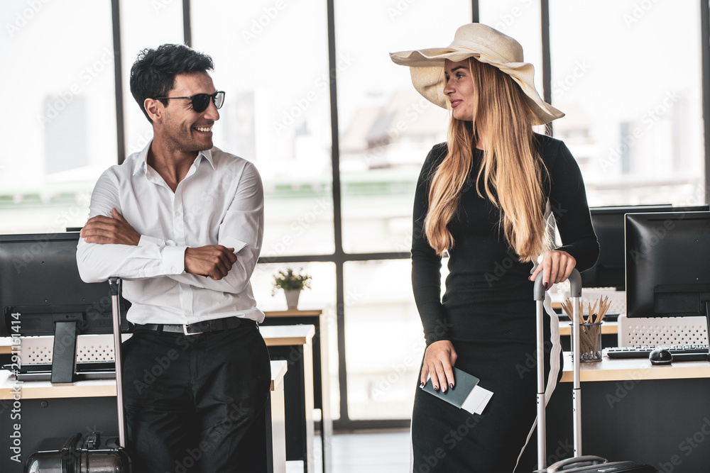 Employee in office ready to travel on summer vacation and celebrating ...