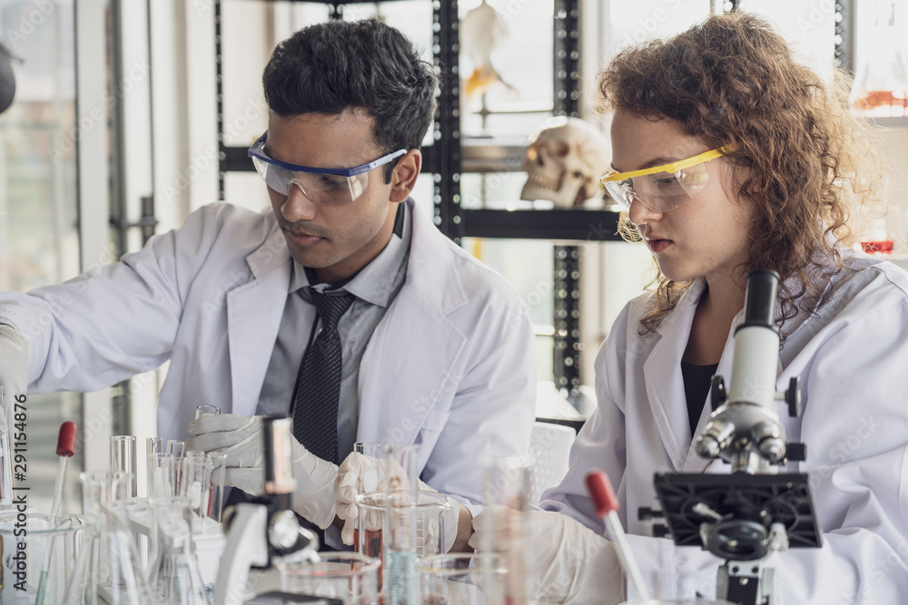 Team of Medical Research Scientist Conducts Experiments in Laboratory ...