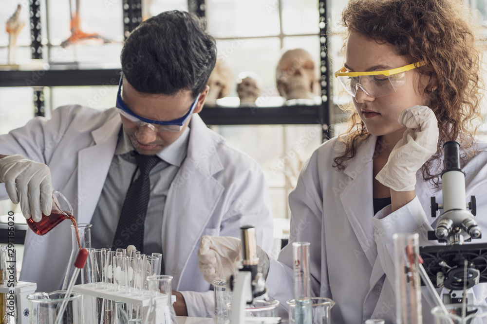 Team of Medical Research Scientist Conducts Experiments in Laboratory ...