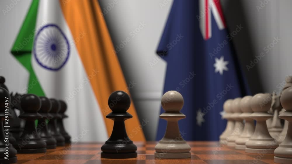 Chess game against flags of India and Australia. Political competition ...