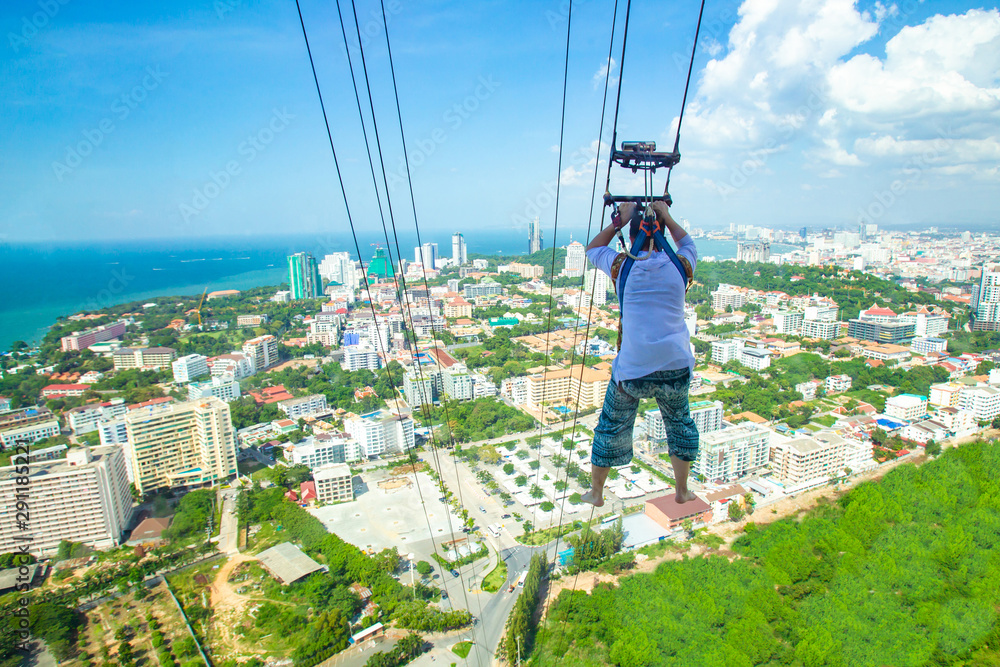 Foto de Thailand. Pattaya. Descent on a cable from a skyscraper in ...