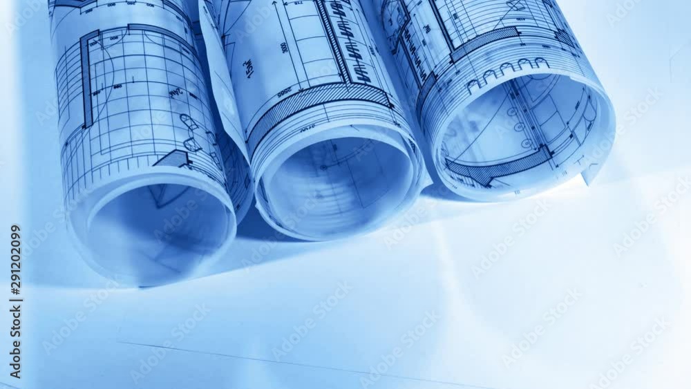 Blueprints - rolls of architectural drawings smoothly rotate on the ...