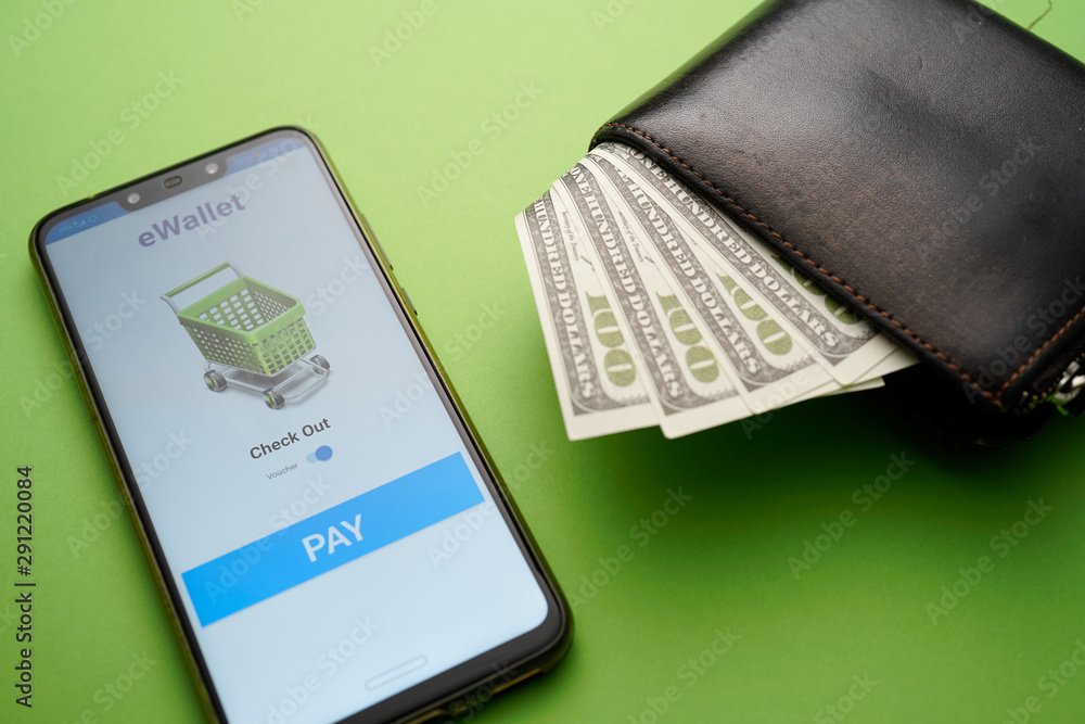 A mobile app eWallet conceptual with mock up apps and dollar bill ...