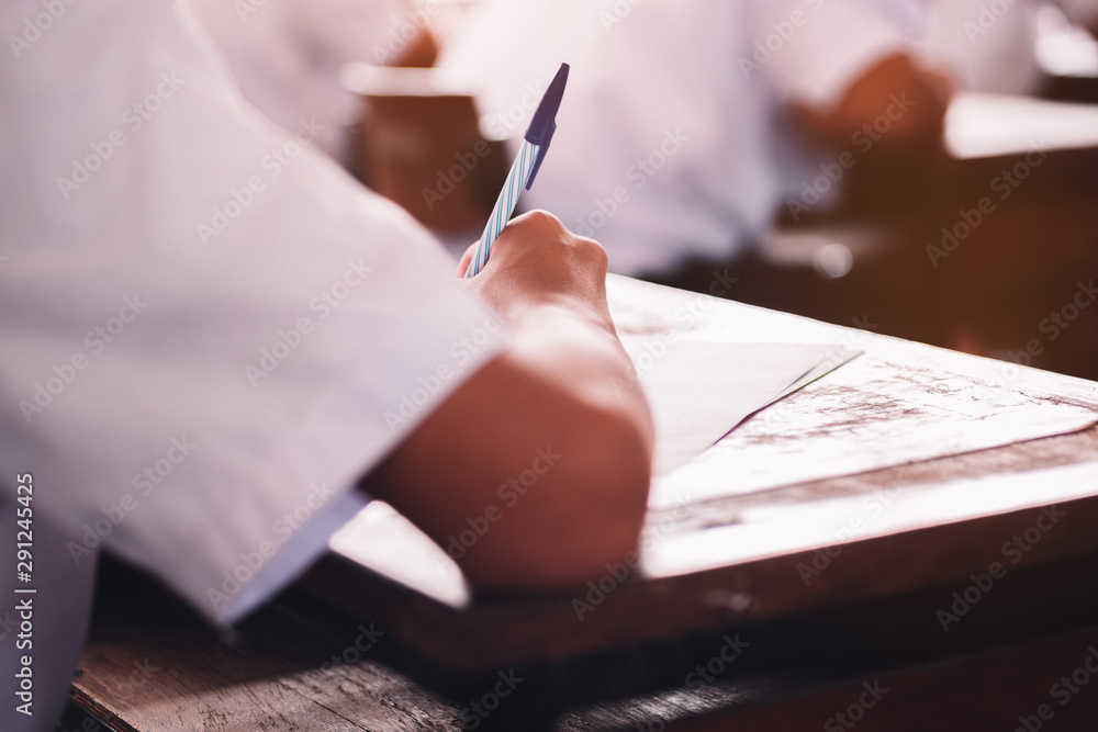 Students taking exam with stress in school classroom Stock Photo ...