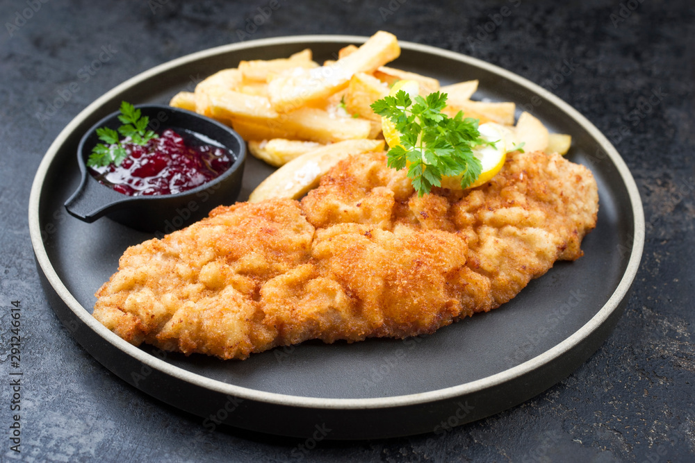 Deep fried Wiener schnitzel from veal topside with French fries and ...