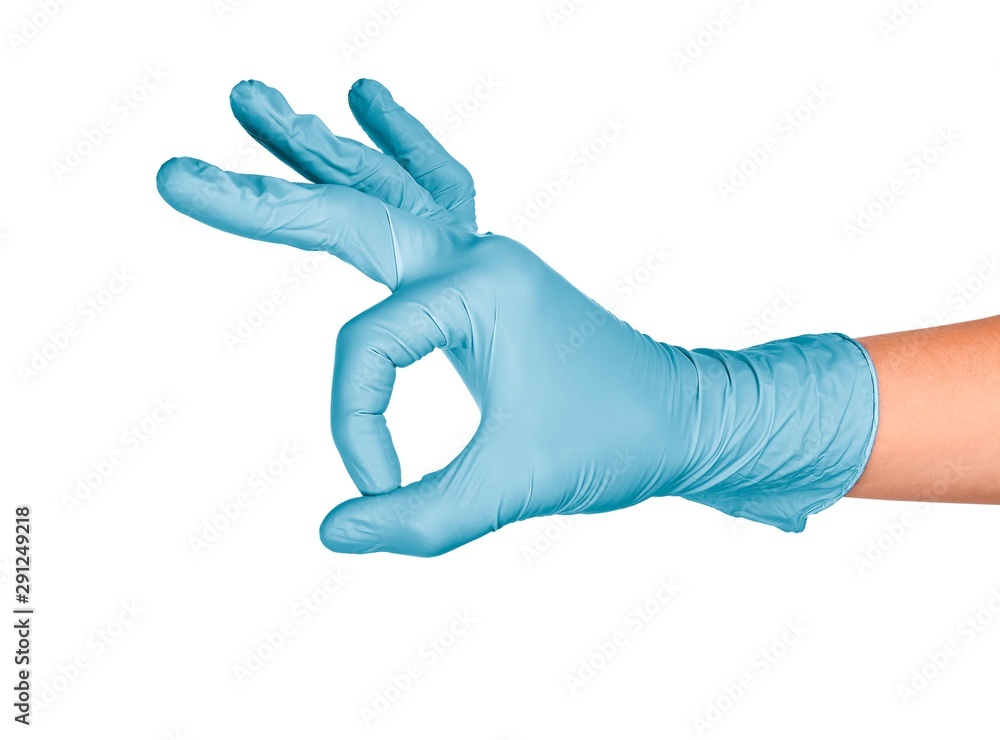 Hand showing ok sign against white background. Hand in a purple latex ...