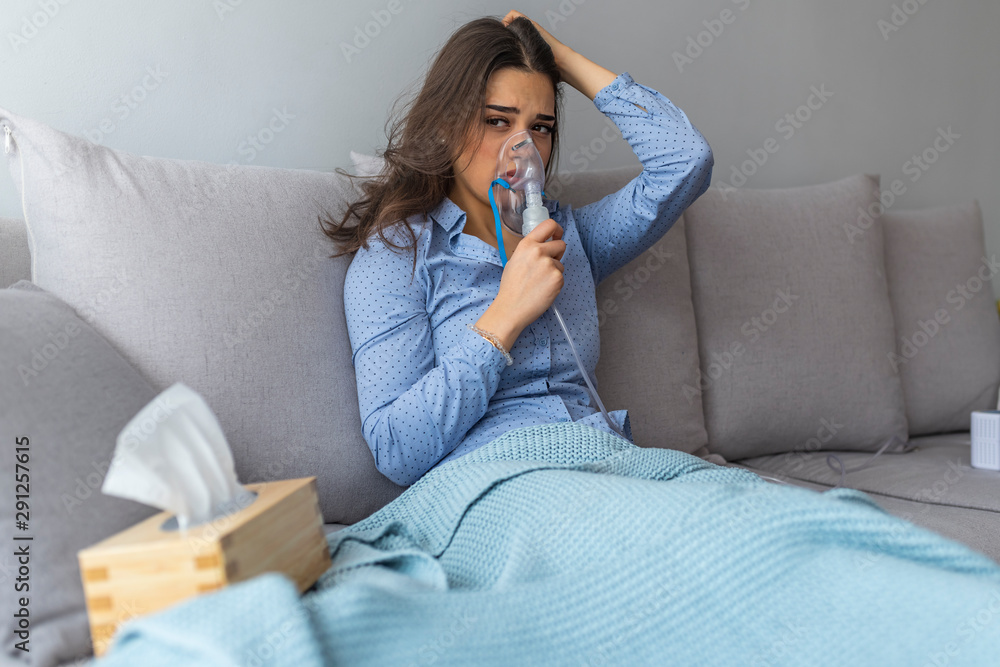 Nebulizer aerosol woman inhaler machine medicine at home. Portrait of a ...