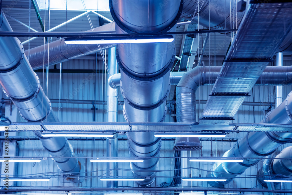Air conditioning of buildings. Background of ventilation pipes. Laying ...