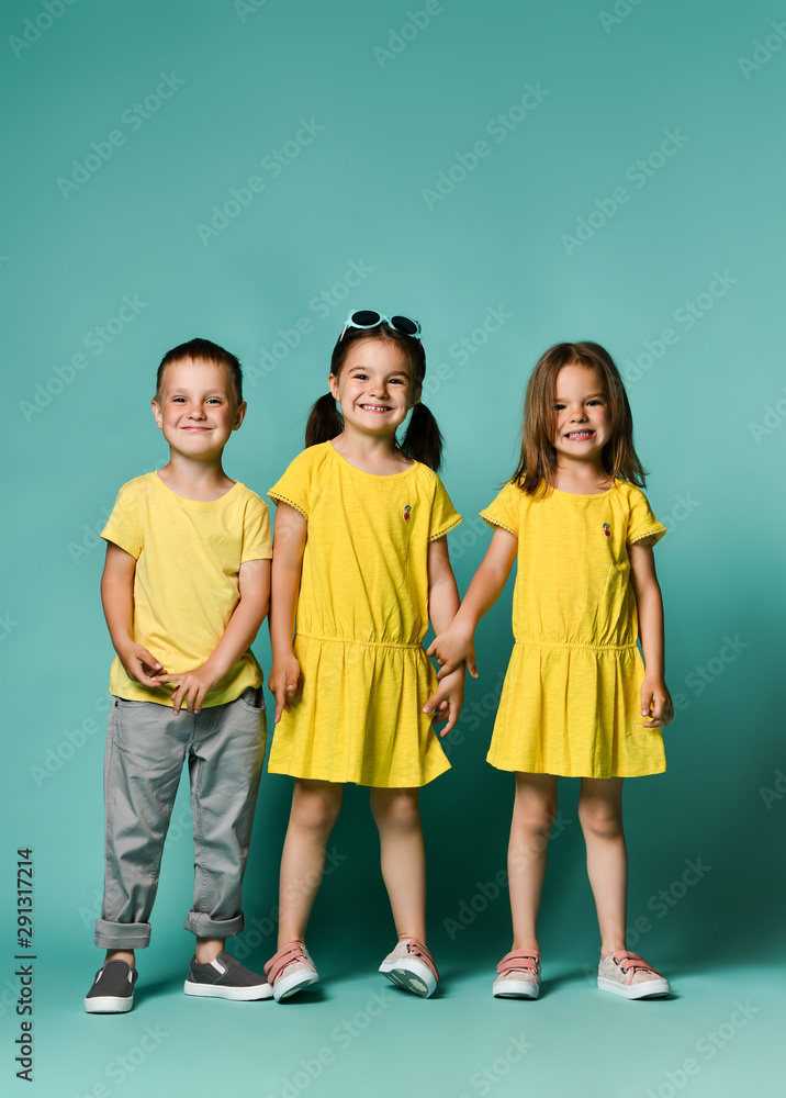 Triplets, brother and sisters. laughing and screaming loud have fun in ...