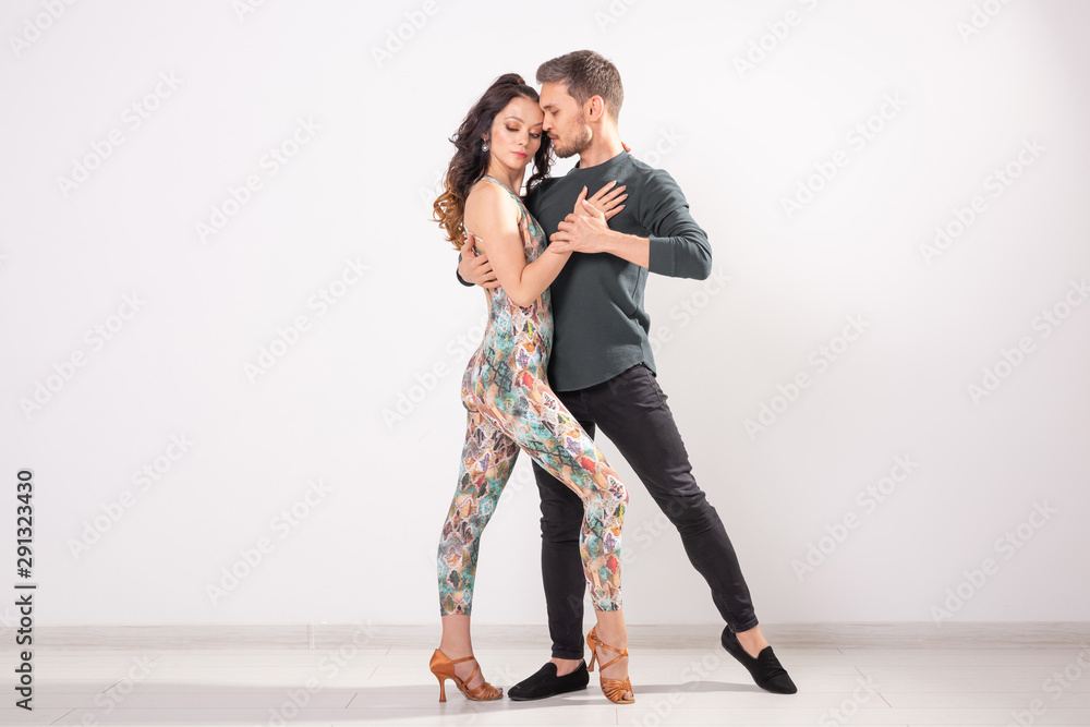 Young couple dancing social latin dance bachata, merengue, salsa. Two ...