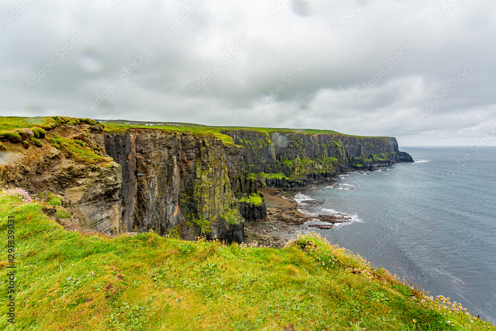 Irish landscape of the rocky cliffs along the coastal walk route from ...