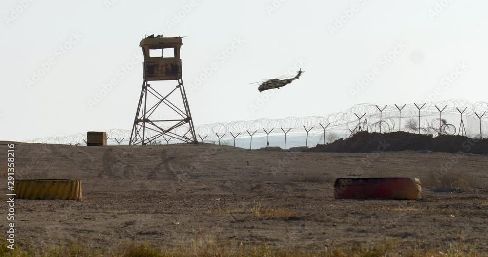 Military Watch Tower with Helicopter Flying Over Military Helicopter ...